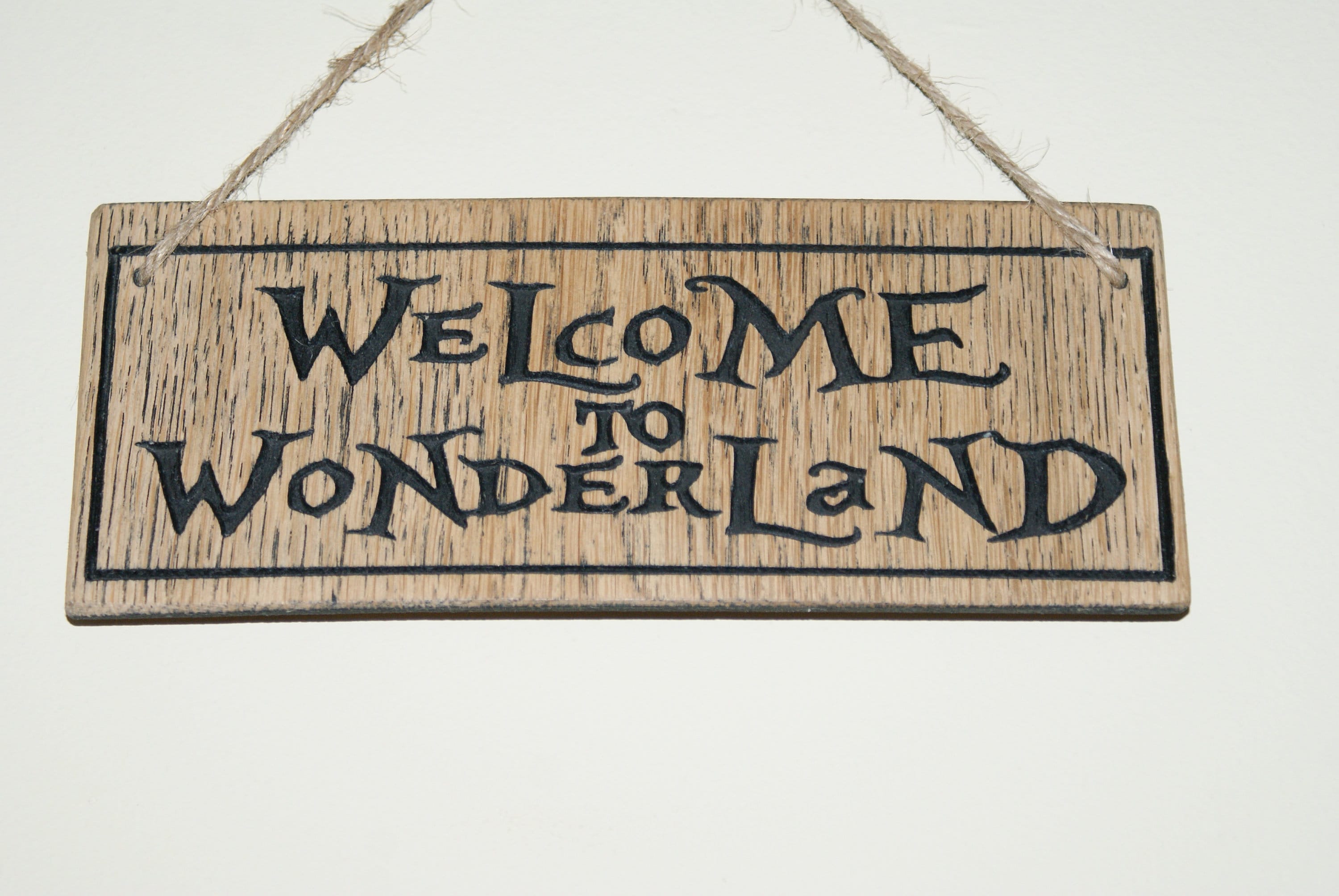 Welcome To Wonderland Sign