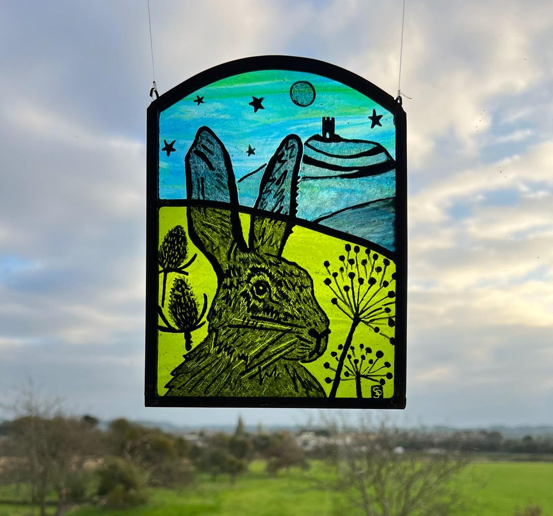 Stained Glass Hare With Moon and Stars at Glastonbury. Teasels. Arch ...