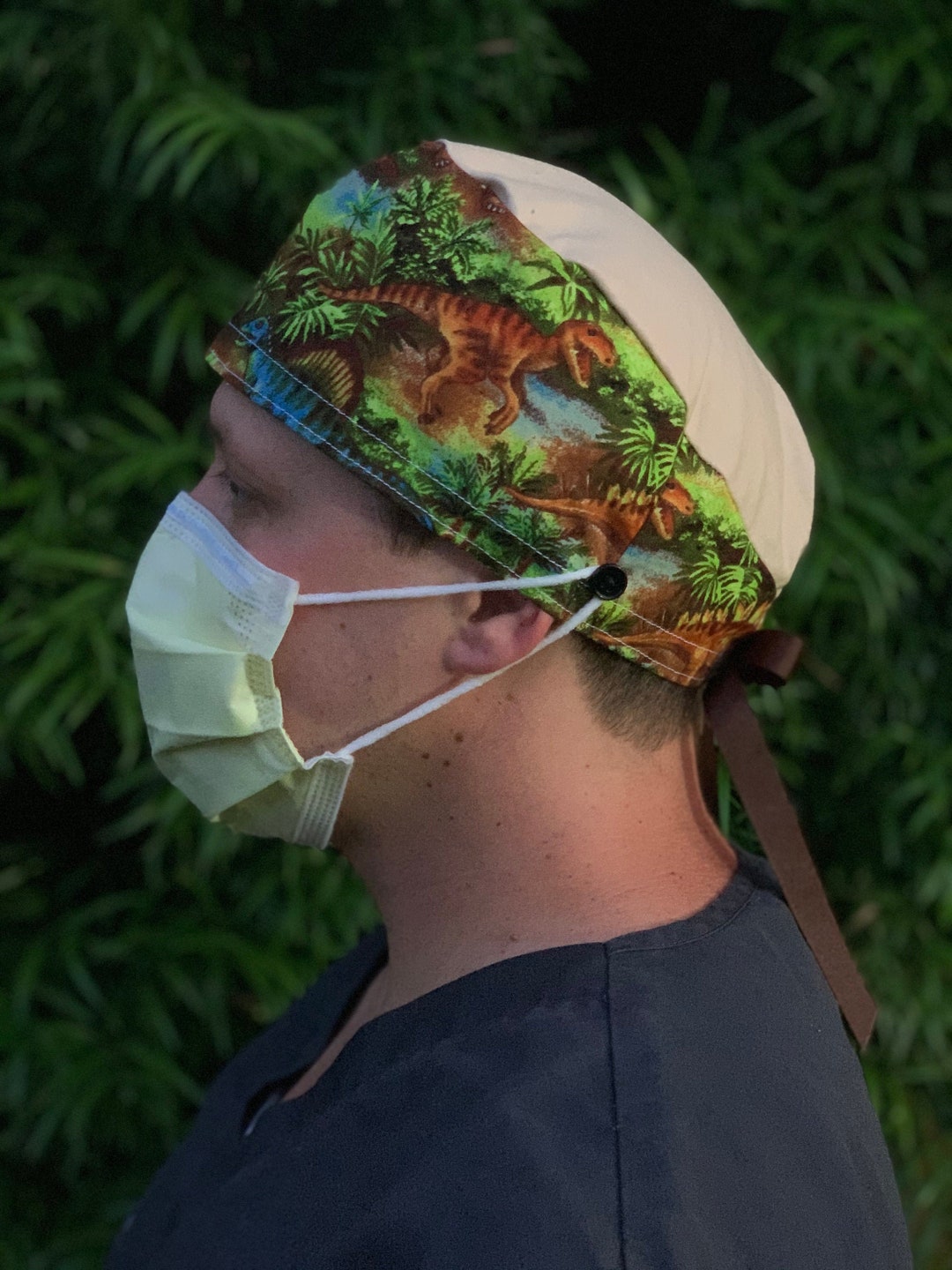 Dinosaur Surgical Cap With Button, Jurassic Park Like Scene Featuring T ...