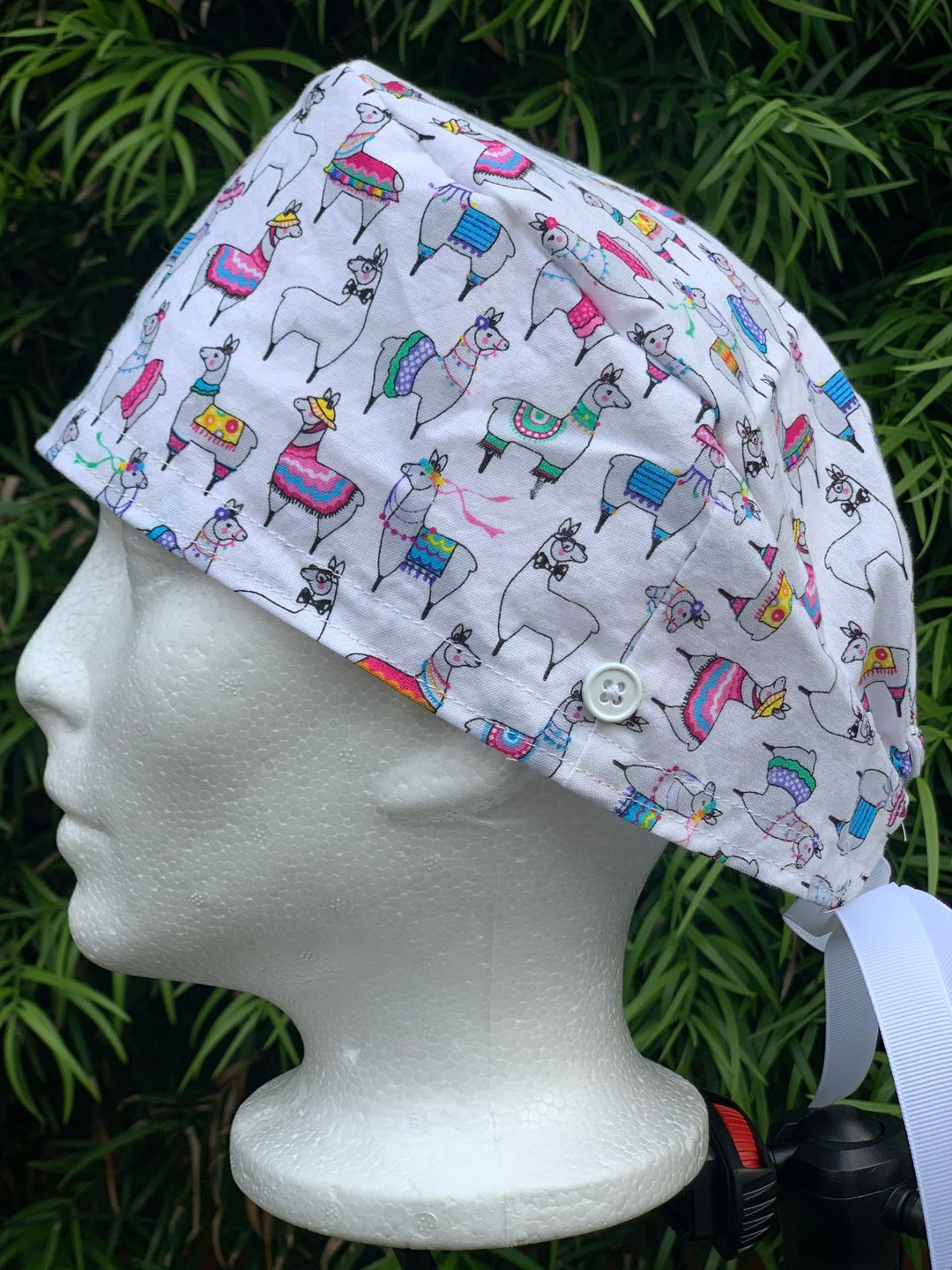 LLamas in ponchos and sombreros scrub cap with buttons. RN, doctor ...