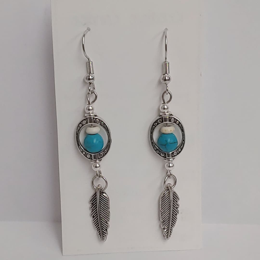 Pendientes de plumas de plata - Etsy España