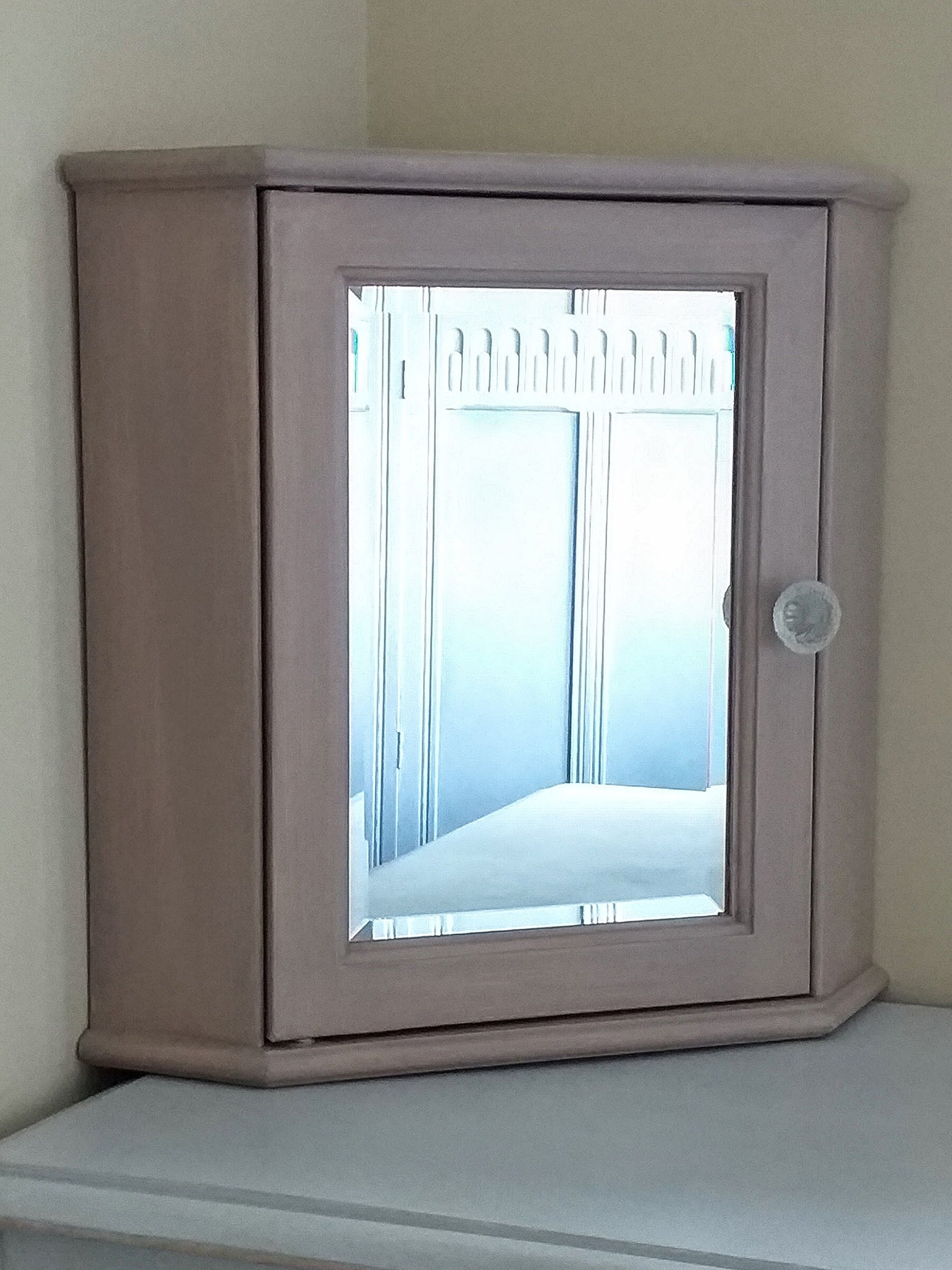 Small corner cupboard with a mirrored door for a bathroom or cloakroom ...