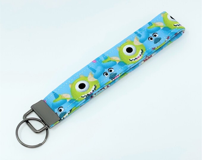 Monsters Blue Green One Eye Theme Park Wristlet Keychain Modern Key Fob ...