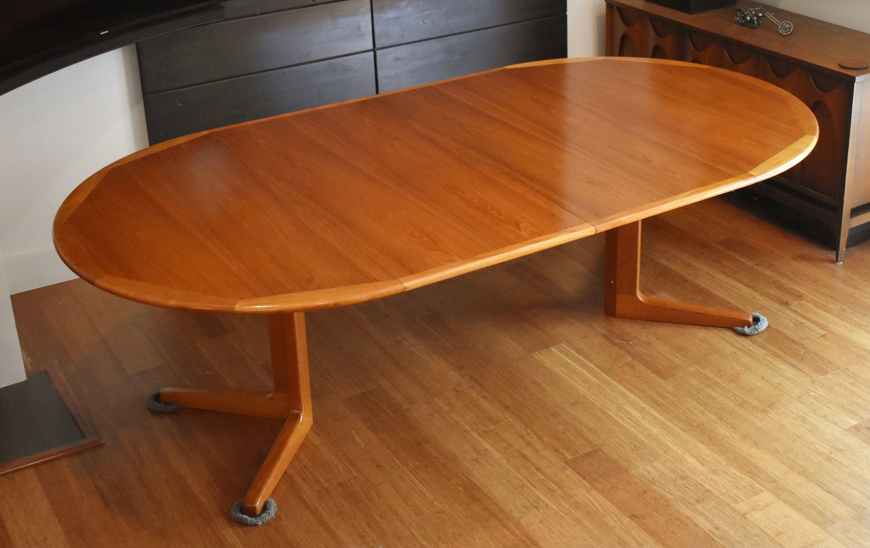 Restored Danish teak round-to-oval expandable dining table (49- 92.5 long)