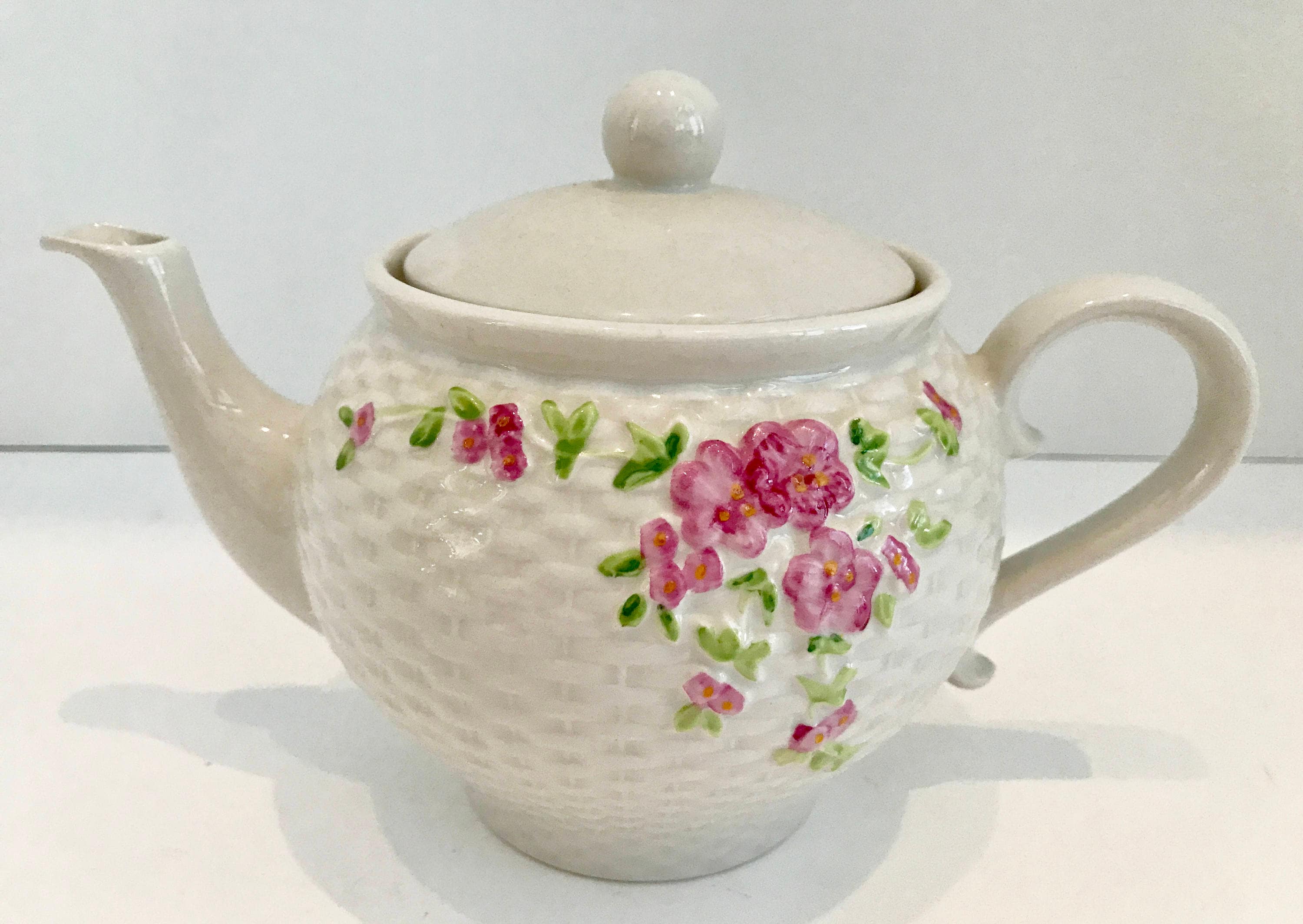 Teapots With Flowers In Them