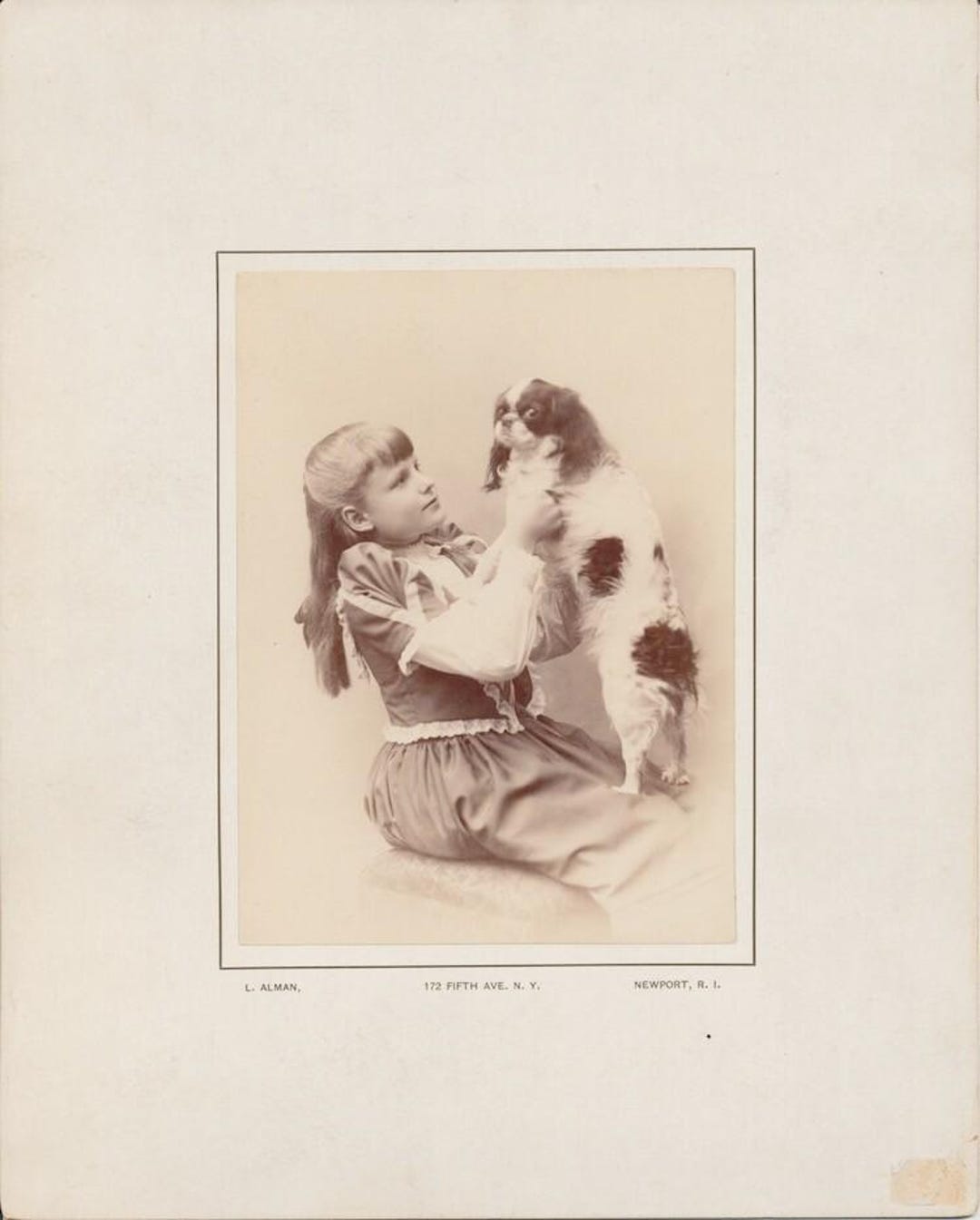 Vintage Portrait Photo: Curly-haired Girl Playing With King Charles ...