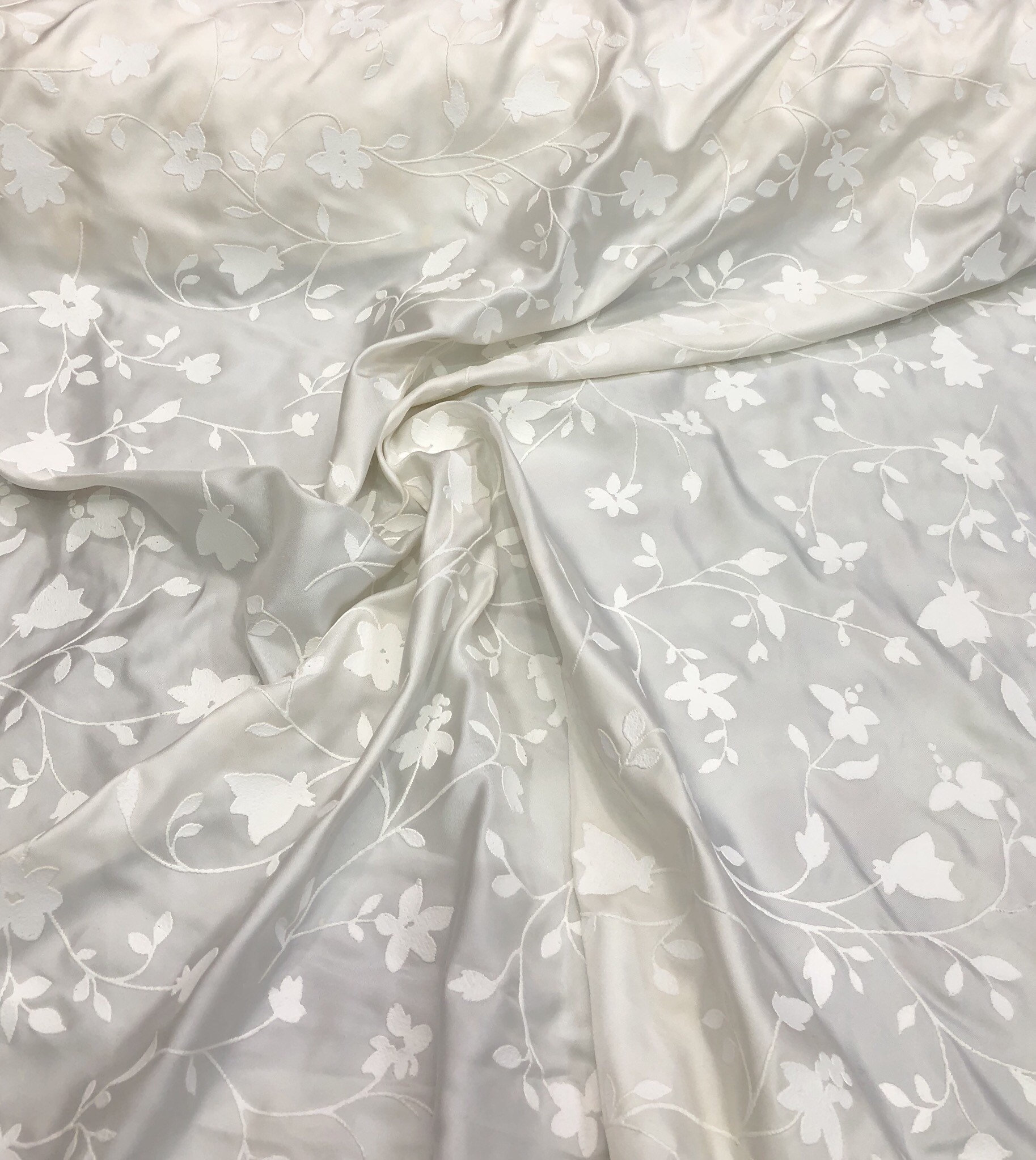 100% silk 58 wide Ivory silk with embosed ivory flowers on the fabric ...
