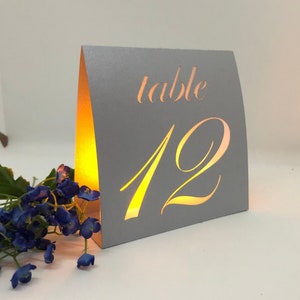 Classic Table Number Luminaries Are Made With Cream, Gold Leaf, or ...