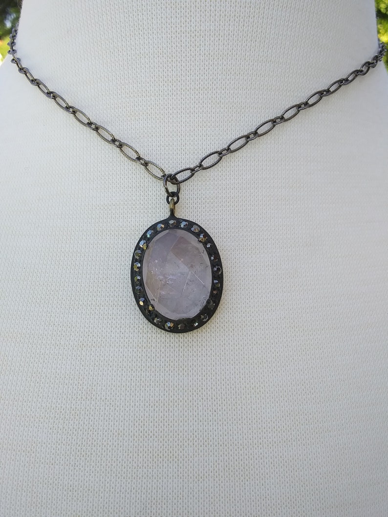 Amethyst Amulet necklace with small Hematite stones surrounding the ...