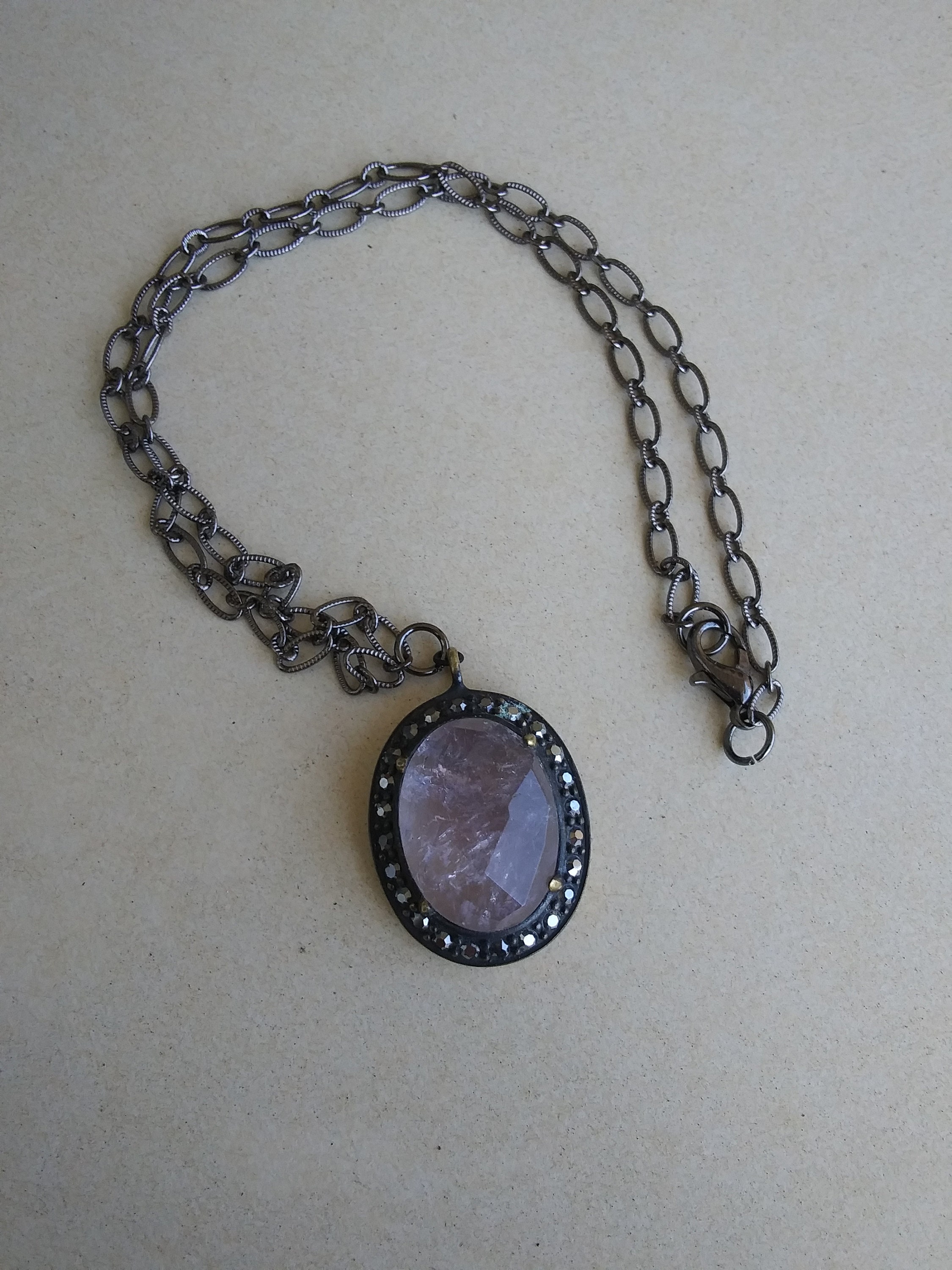 Amethyst Amulet necklace with small Hematite stones surrounding the ...