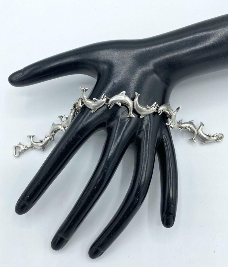 Sterling silver dolphin link bracelet. Marked 925. Designer signed ...