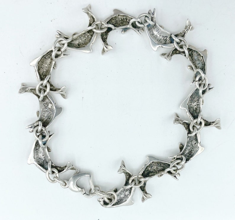 Sterling silver dolphin link bracelet. Marked 925. Designer signed ...