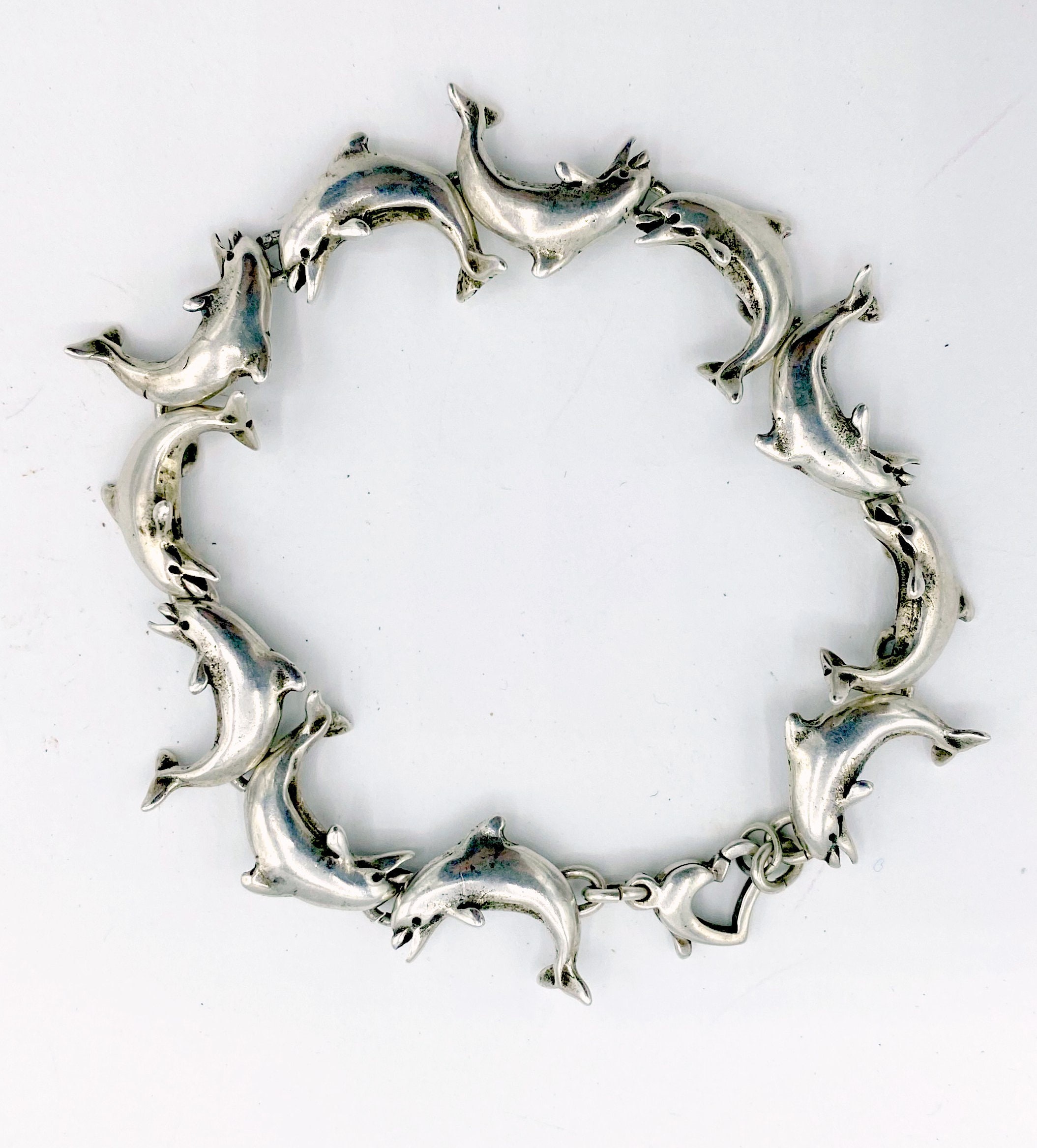 Sterling silver dolphin link bracelet. Marked 925. Designer signed ...