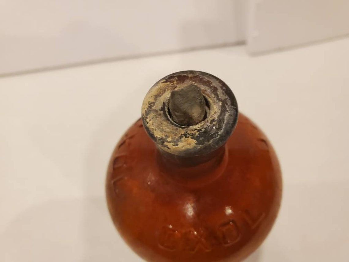 Vintage OXOL Brown Embossed Bottle With Stopper - Etsy
