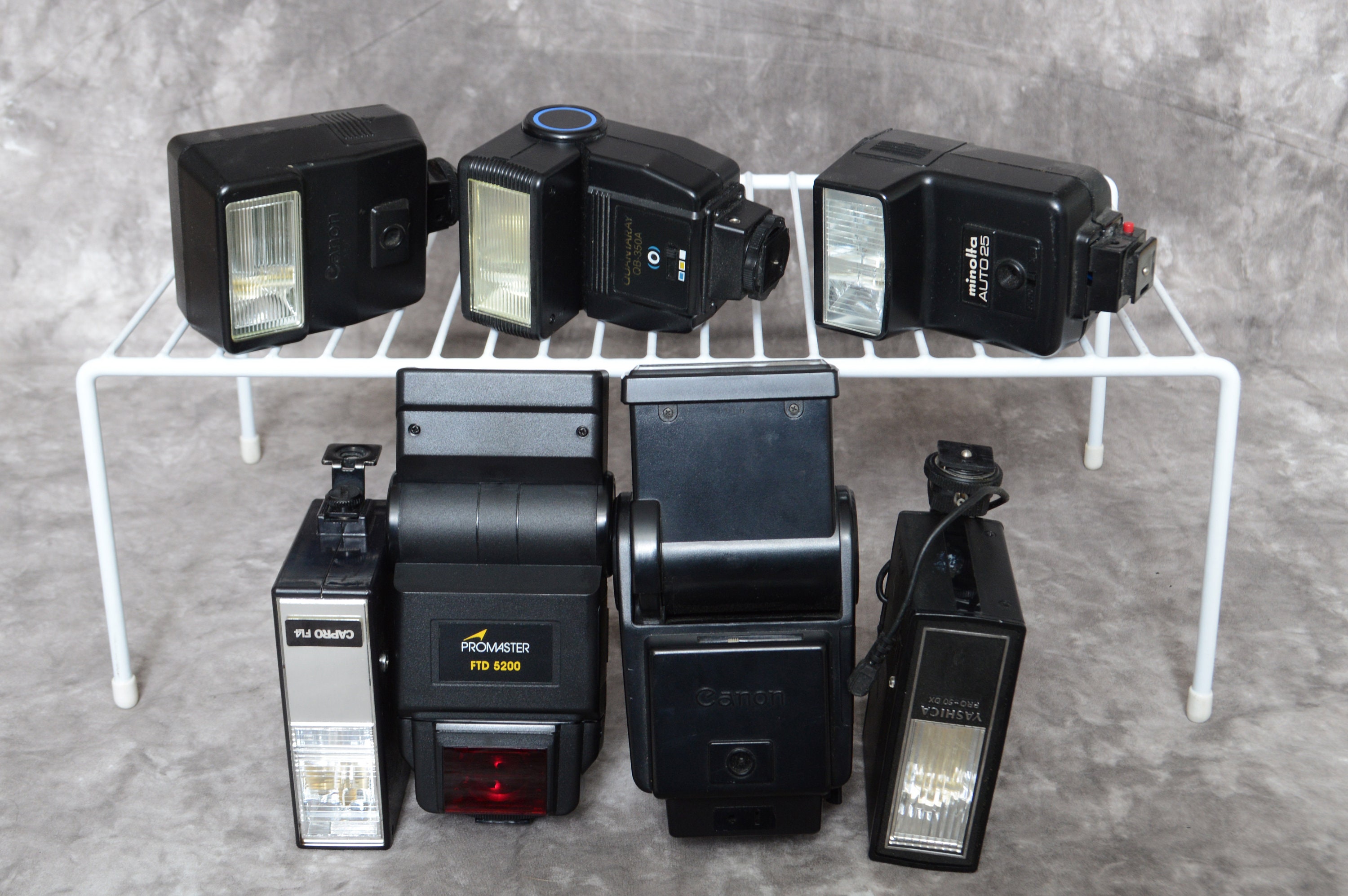 Group of 7 Various Camera Flash Units Canon, Promaster, Minolta ...