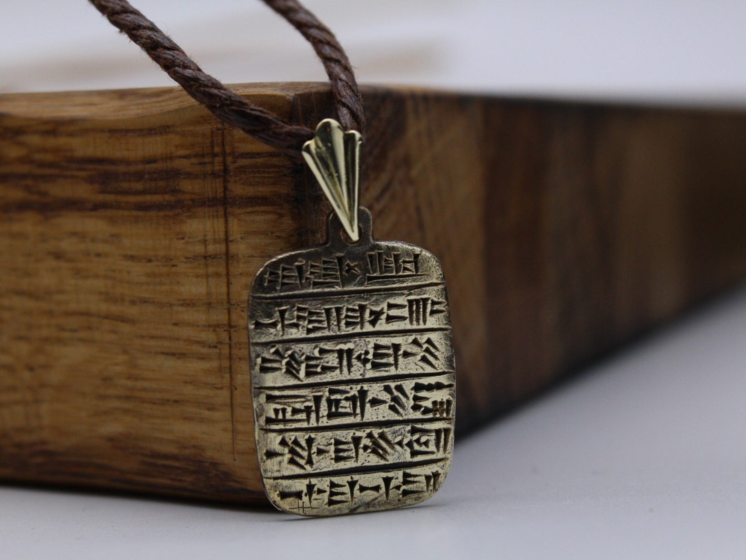 A Pendant in the Form of a Clay Tablet With Cuneiform Writing. A Gift ...
