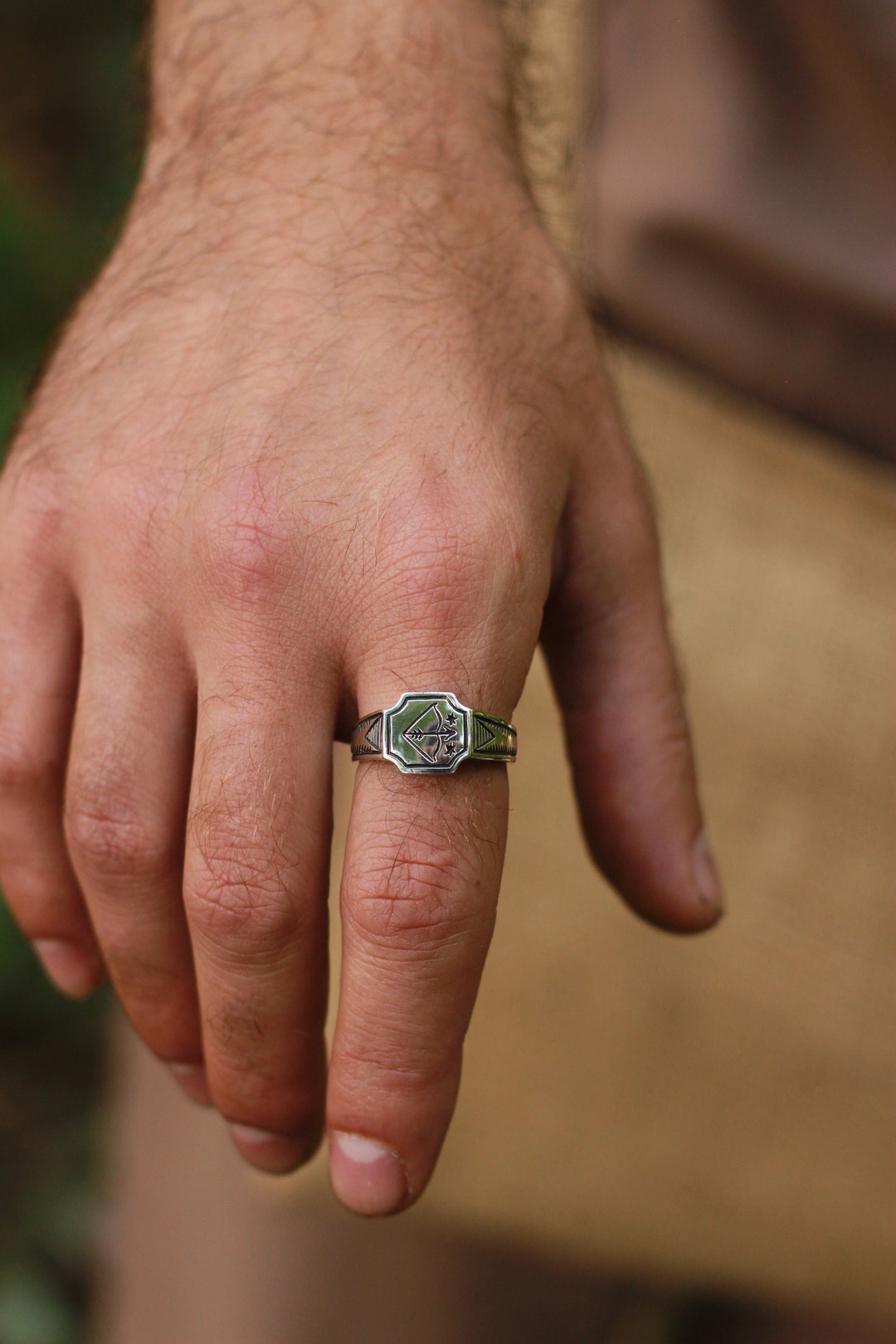 Ring With a Coat of Arms in the Form of a Bow With Arrow and Stars ...