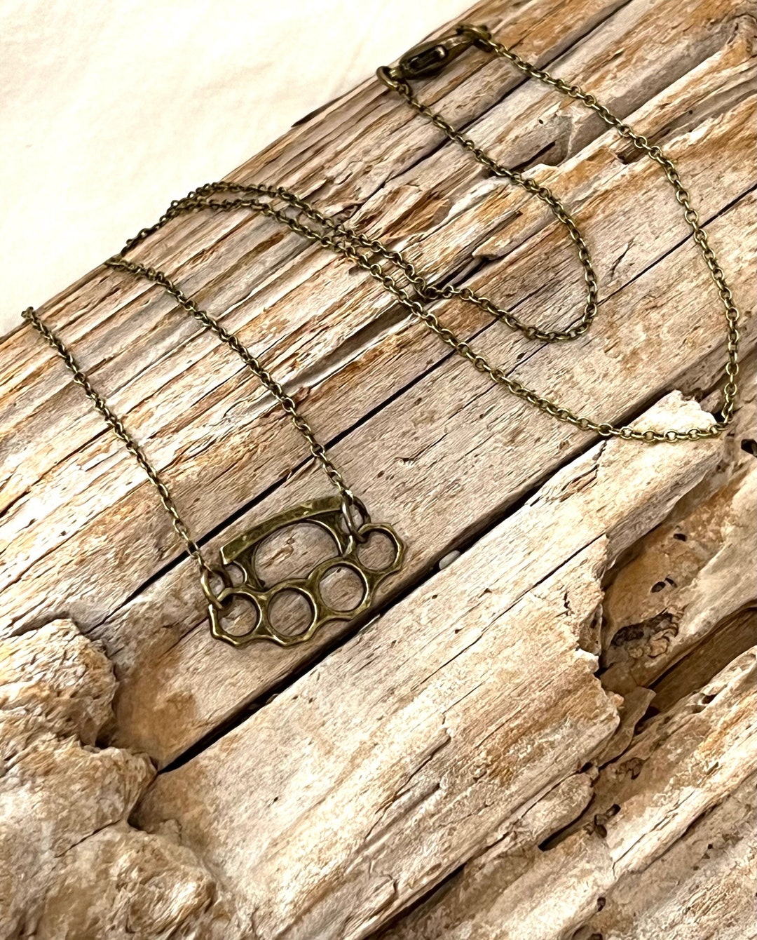 Brass Knuckles, Bronze Tone Connector Pendant, on a Bronze Tone Cable ...