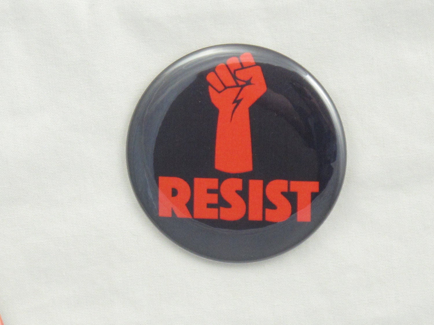 Resist Button. Pin-back Button. Resist Pin. Resist. Red Power Fist ...
