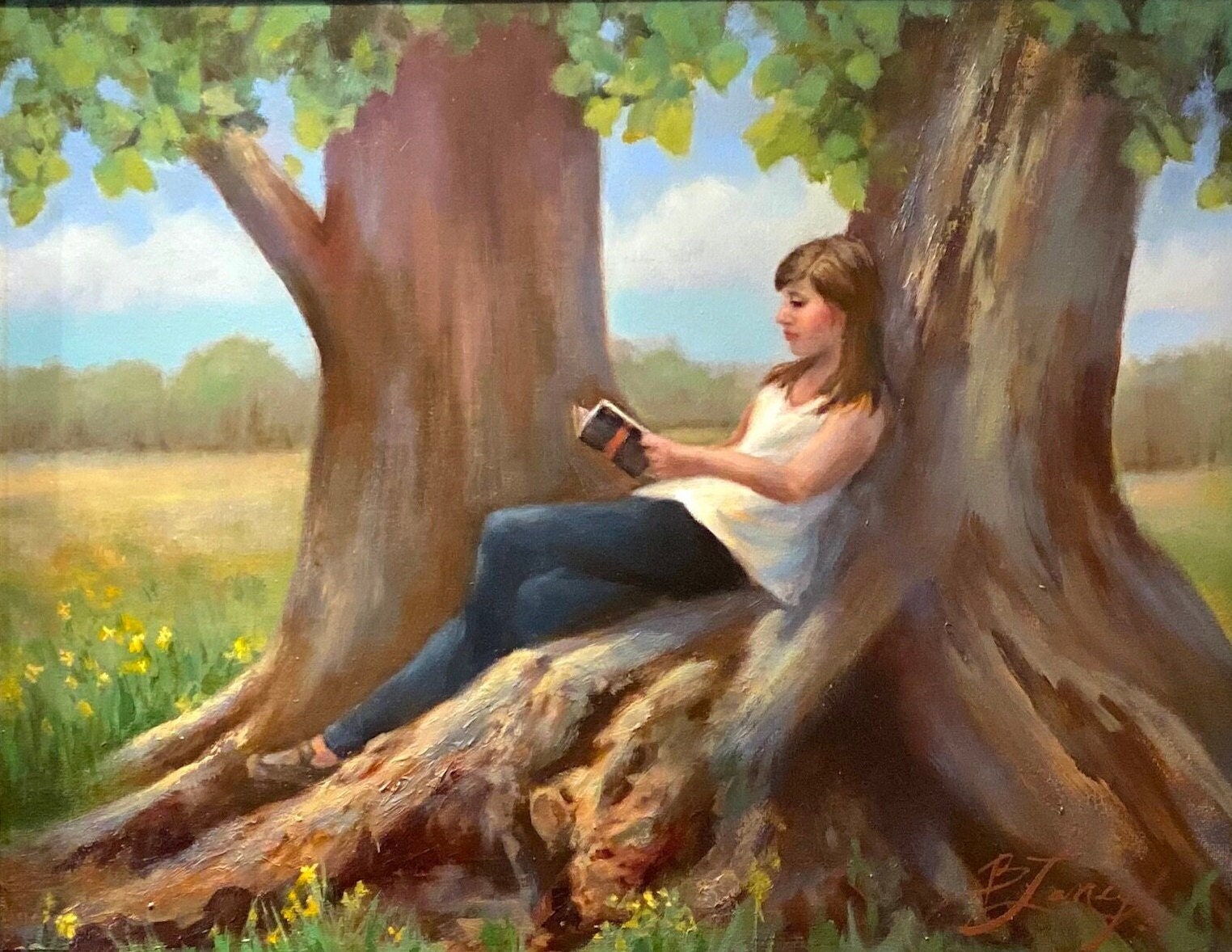 Girl Reading A Book Under A Tree