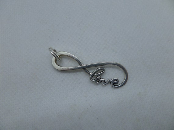 Infinity love in cursive writing silver pendant - Gem