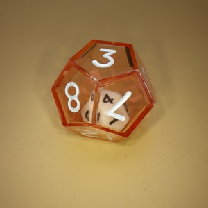 Double D12 - Small Twelve Sided Die in Larger Transparent Twelve Sided ...