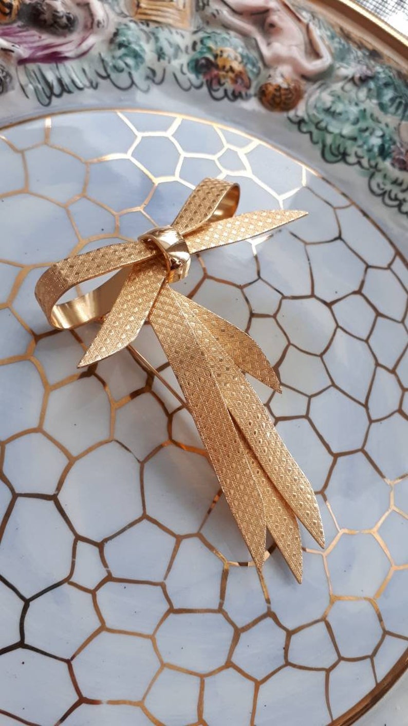 Fascinating vintage Christian Dior gold oversize ribbon bow | Etsy