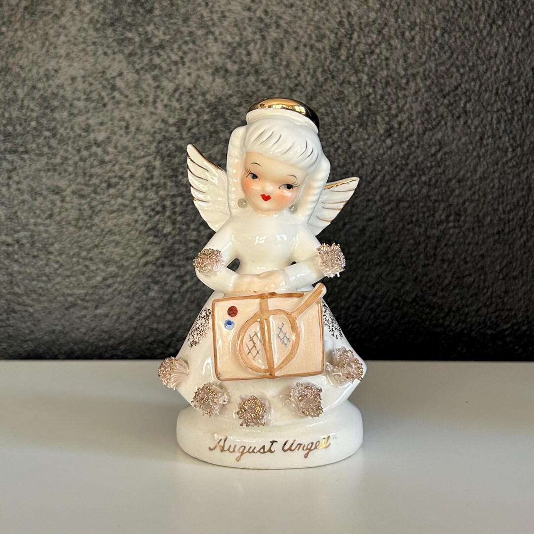 Napco August Birthday Angel Figurine - Holding Luggage and Tennis ...