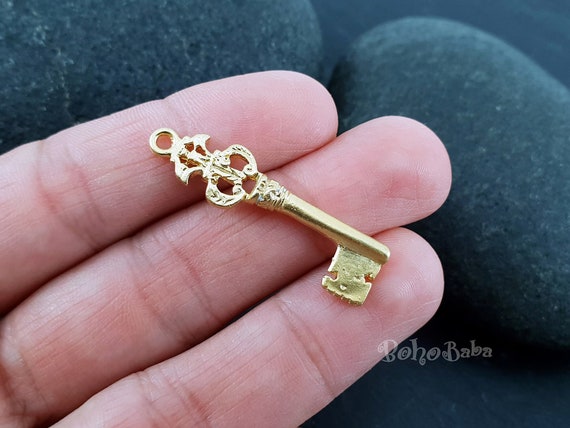Gold key charm store