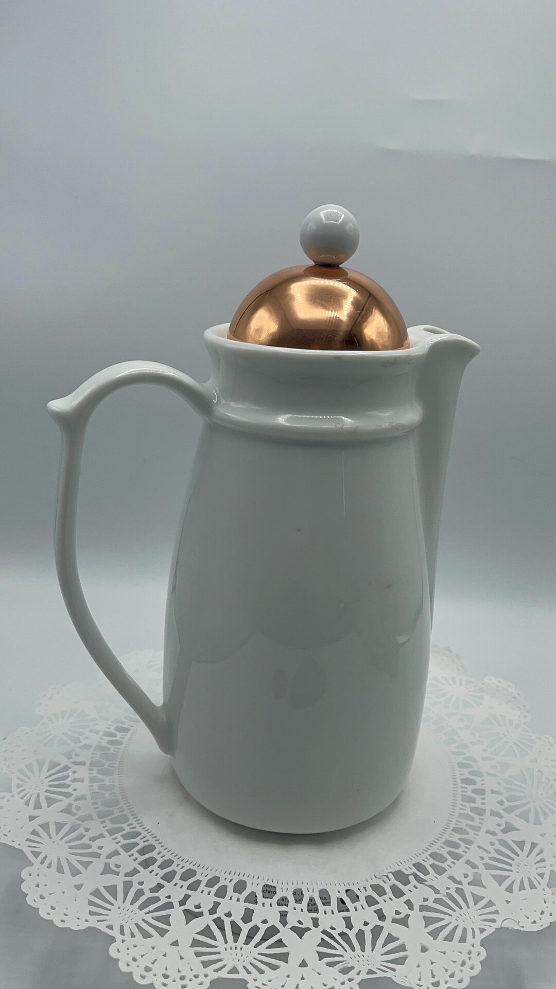 Beautiful and Elegant Vintage Coffee Pot Made of White Ceramic With a White Ceramic Handle and a ...