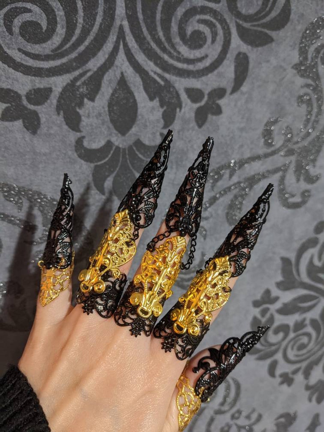 Two Hands Armors and 10 Black and Gold Articulated Full Finger Rings ...