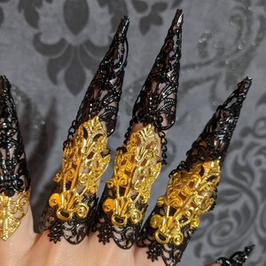 Two Hands Armors and 10 Black and Gold Articulated Full Finger Rings ...