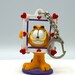 Gorgeous Collectible and Vintage Garfield Keychain With Pictures Frame ...