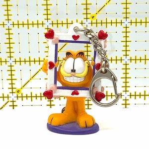 Gorgeous Collectible and Vintage Garfield Keychain With Pictures Frame ...