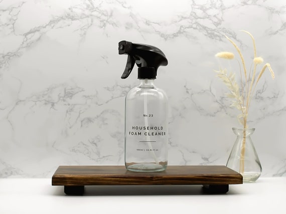 Glass cleaner bottle with spray nozzle store