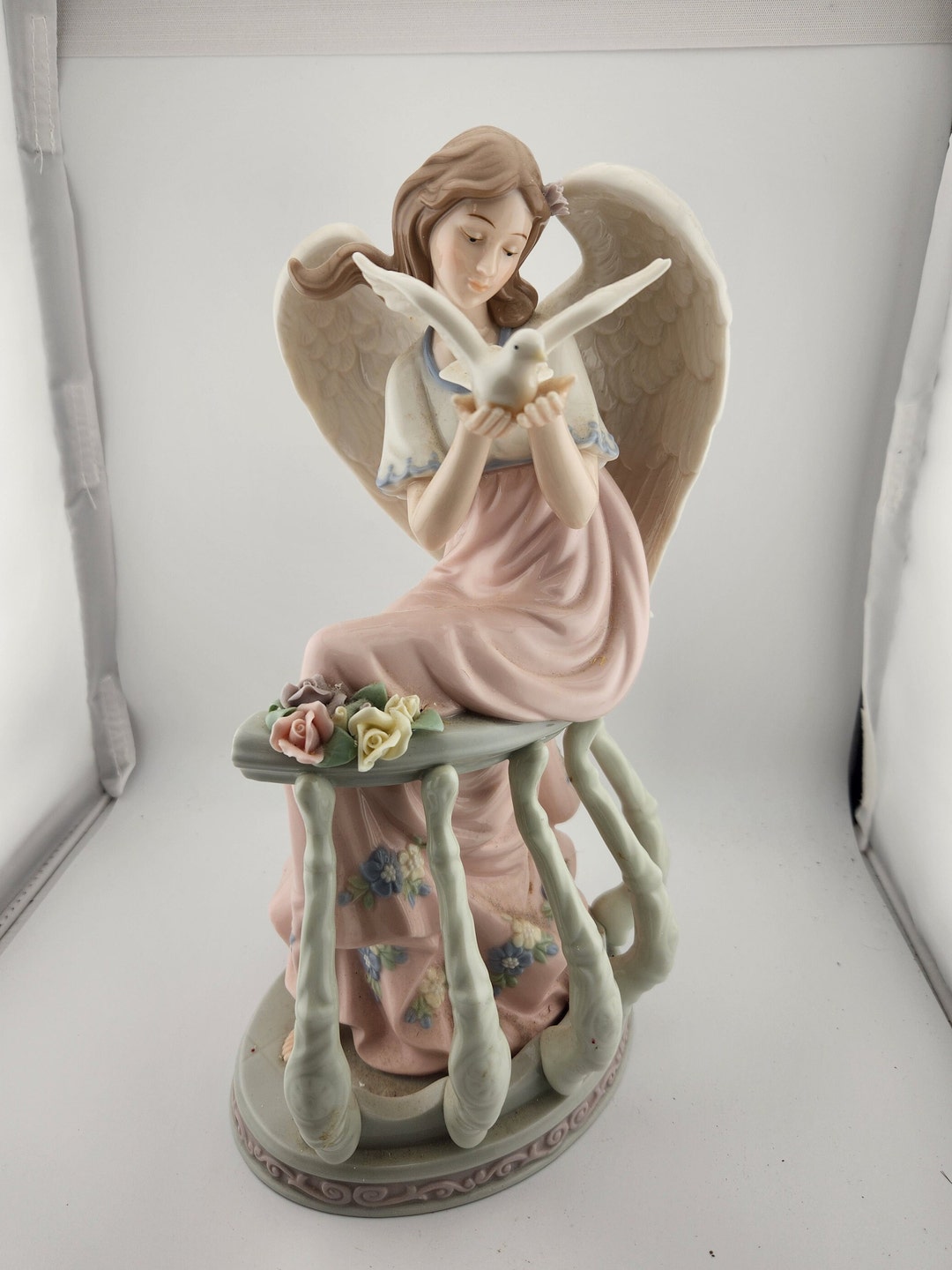 Vintage Porcelain Angel Holding Dove Sitting on a Garden Rail by O'well ...