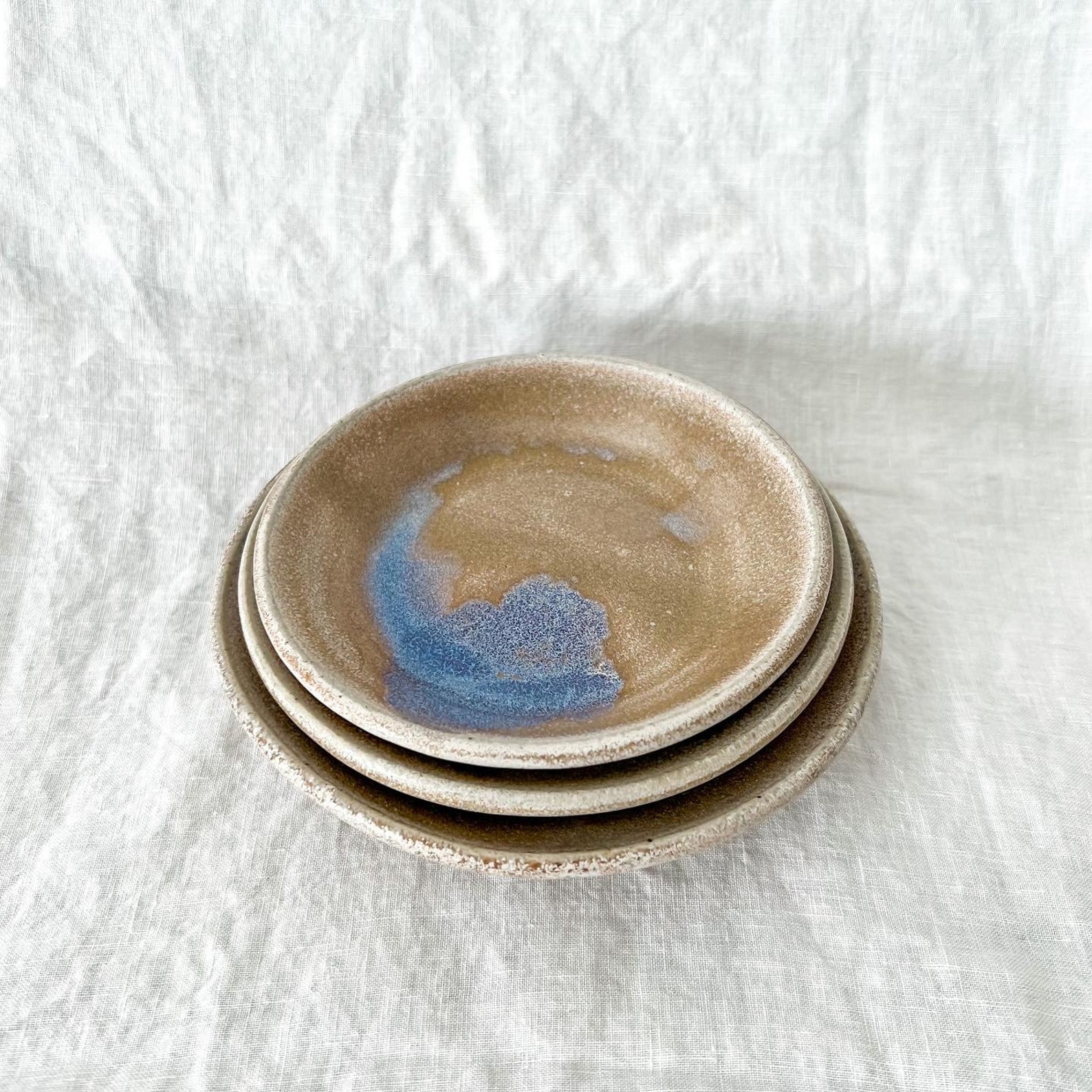 Vintage Handmade Nesting Pottery Plates | Blue and Brown Plates ...