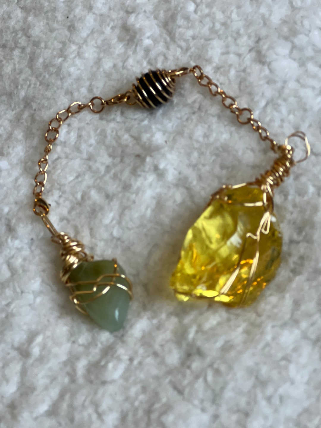 African Jade Pendulum With an Luminescent Yellow Andara Handle and a ...