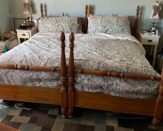 Antique bed with carved pineapples store