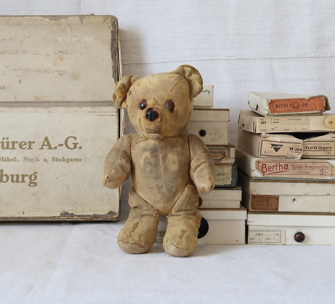 Antique straw filled teddy bear Small tattered animal without fur ...