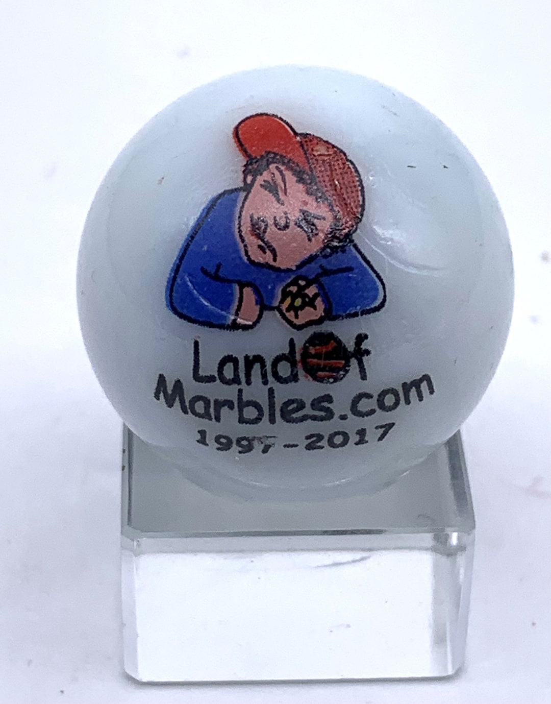 Single 25mm Land of Marbles Logo Shooter Collectible Marble White Base With Full Color Brand ...