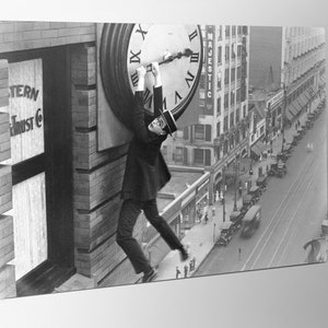 Harold Lloyd in Safety Last the Iconic Shot of Lloyd Hanging From the ...