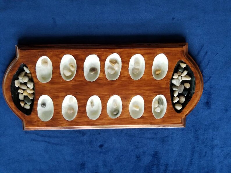 Mancala the real game - nipodlonestar