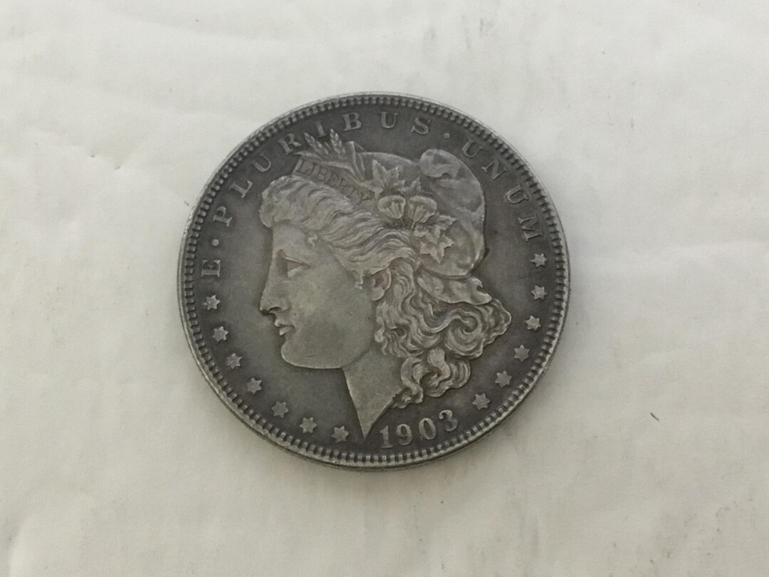 1903 Morgan Silver Dollar.designer George T. Morgan. Silver Fineness 0. ...