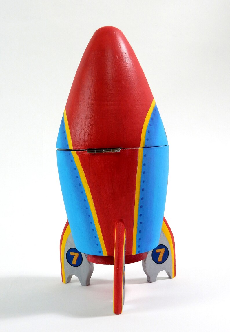 A Wooden Retro Styled Toy of a Rocket With Astronaut Pilot. A Fun Desk ...