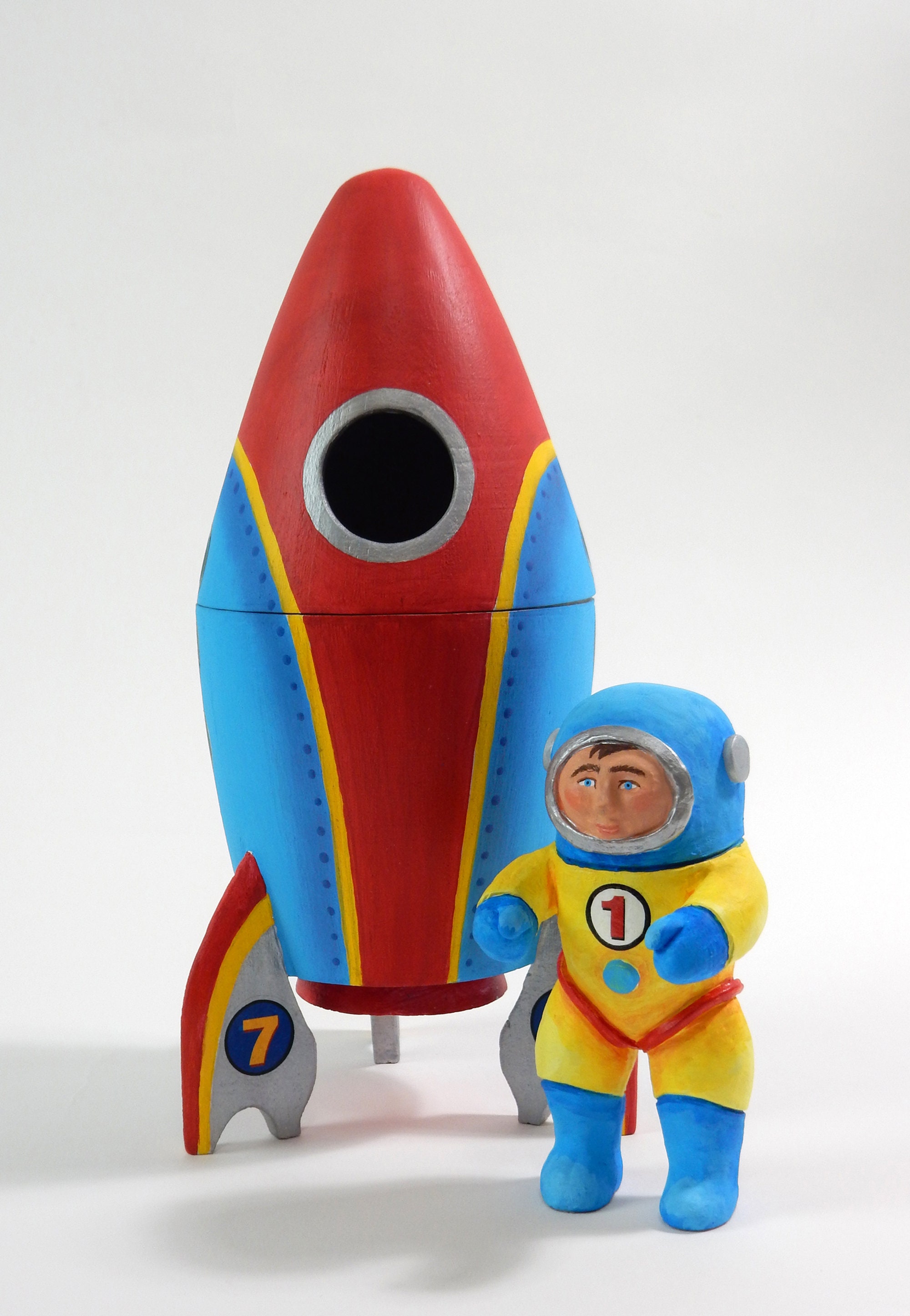 A Wooden Retro Styled Toy of a Rocket With Astronaut Pilot. A Fun Desk ...