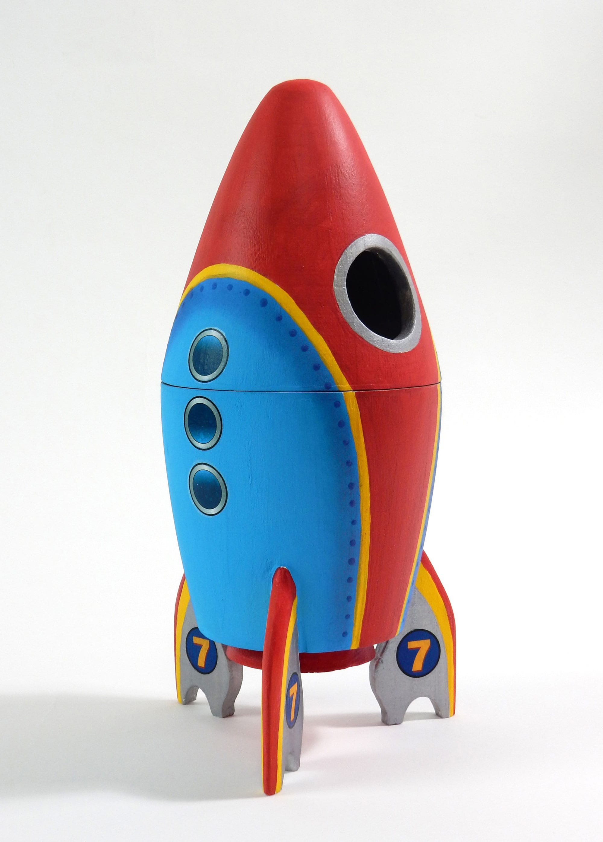 A Wooden Retro Styled Toy of a Rocket With Astronaut Pilot. A Fun Desk ...