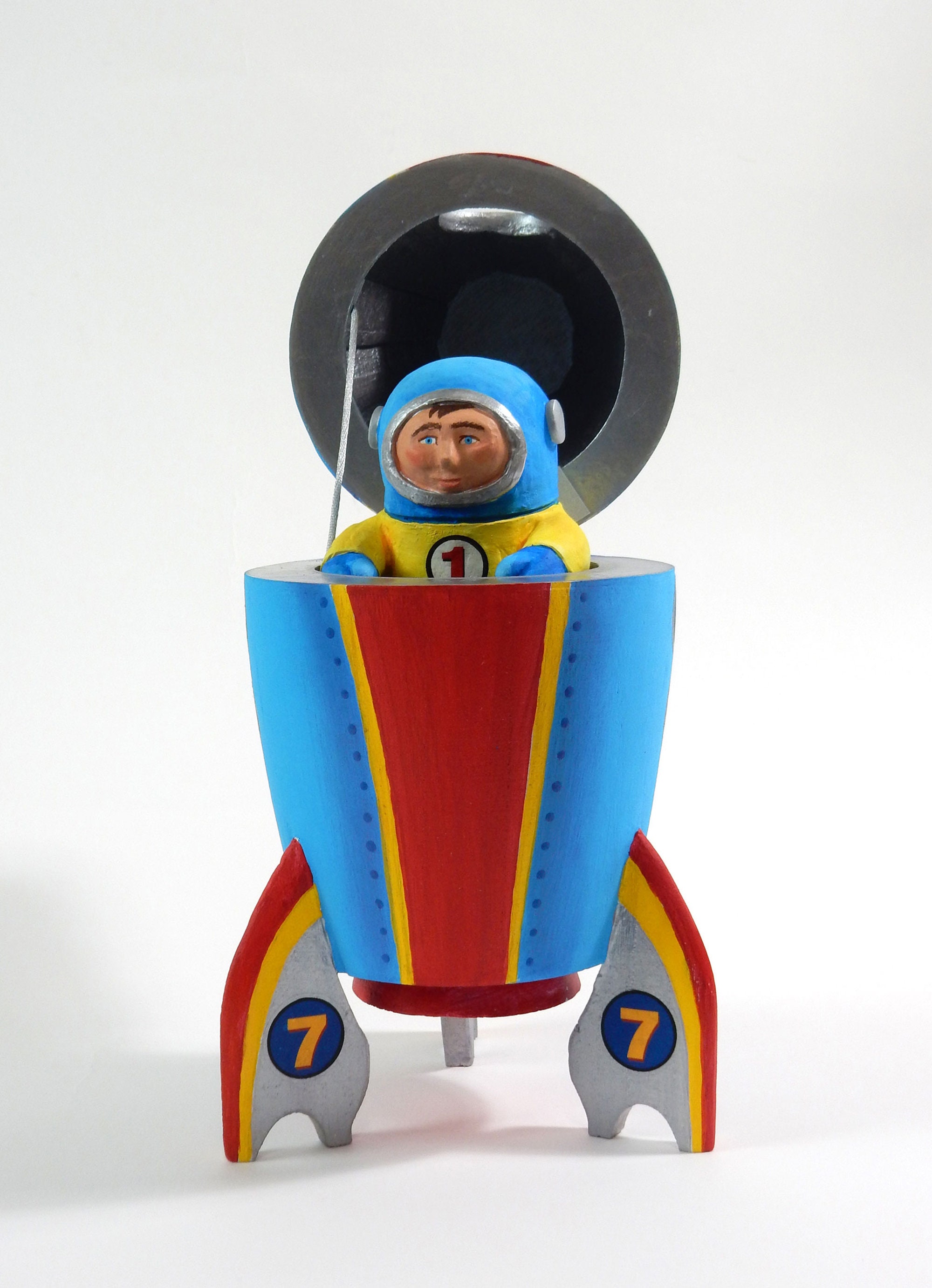 A Wooden Retro Styled Toy of a Rocket With Astronaut Pilot. A Fun Desk ...