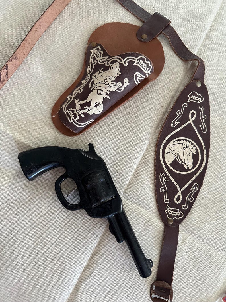 Vintage Buckaroo Toy Gun and Holster With a Whistling Lasso Toy ...