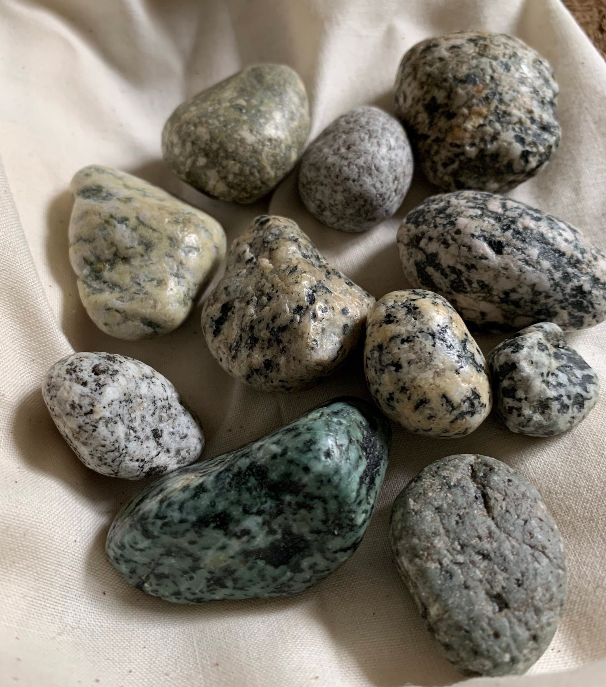 River rocks, black, white, spotted, hand polished, spotted beauties ...